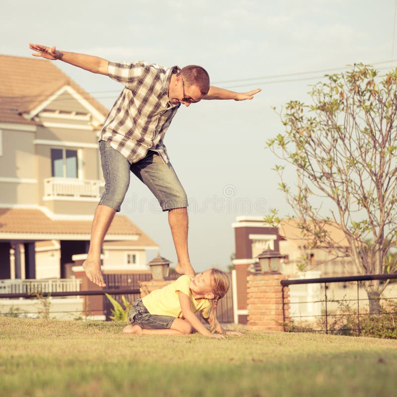 Father and Daughter Playing on the Grass Stock Image - Image of grass ...