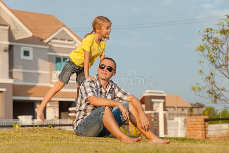 Father and Daughter Playing on the Grass Stock Photo - Image of parent ...