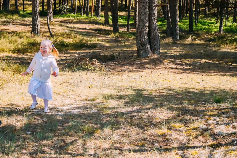 Father and Daughter Playing in a Spring Forest. Active People are ...