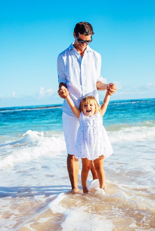 Father and Daughter Playing Together at the Beach Stock Image - Image ...