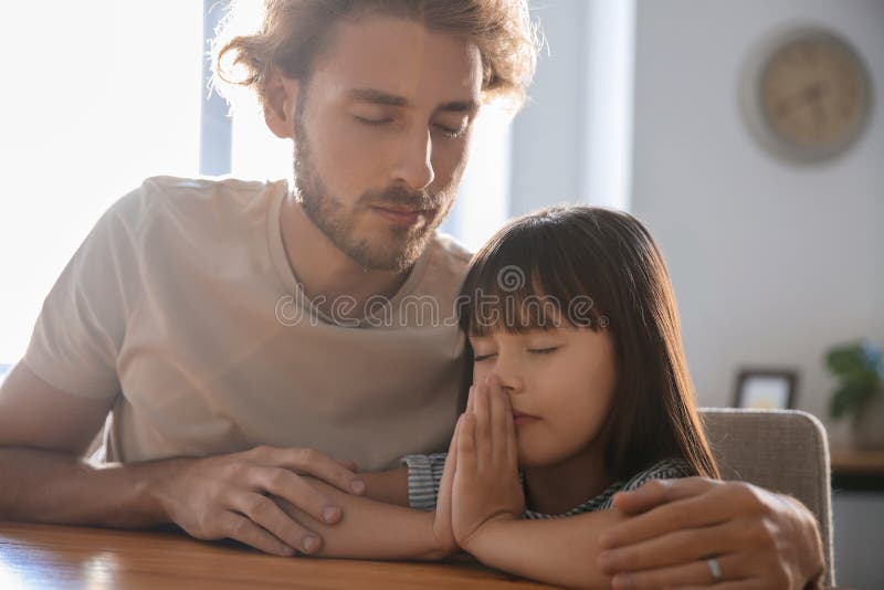 Father with Daughter Praying at Home Stock Image - Image of sitting ...