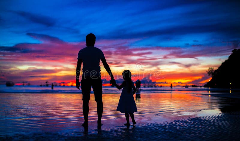 Father And Daughter Silhouettes In Sunset At The Stock Photo - Image ...