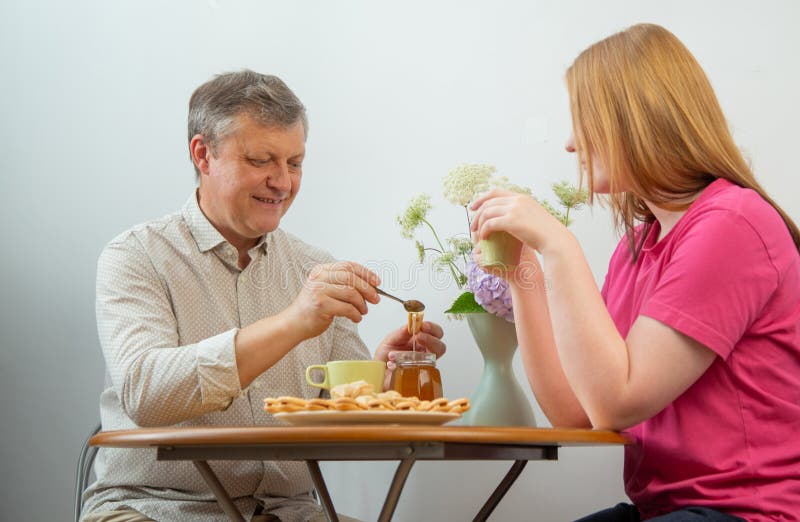 Father Daughter Sitting Table Drinking Tea Cookies Stock Photos - Free ...