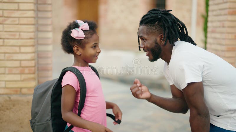 Father and Daughter Standing Together Speaking at School Stock Footage ...