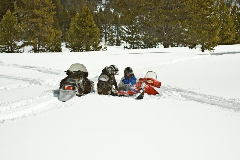 Father and Daughter with Stuck Snowmobile Stock Photo - Image of family ...