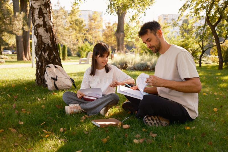 Father and Daughter Studying Together in a Peaceful Park Setting Stock ...