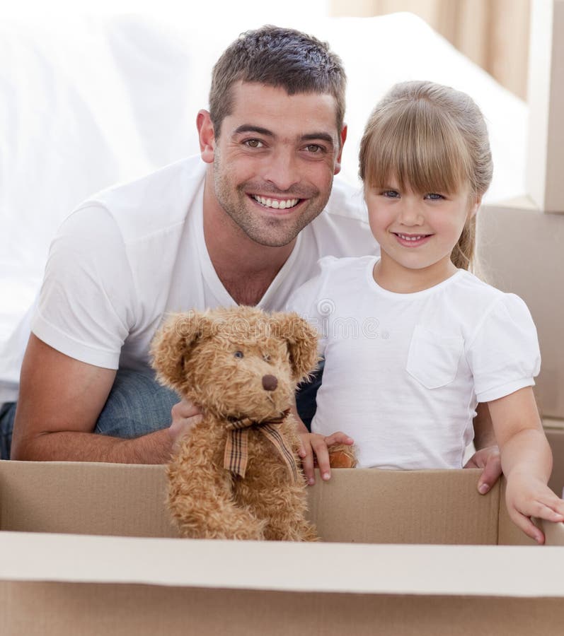 Father and Daughter with a Teddy Bear Moving Home Stock Image - Image ...