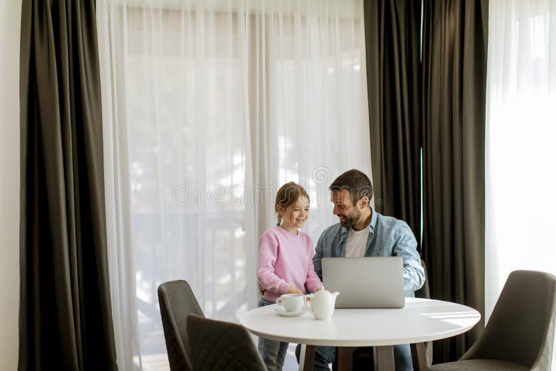 Father and Daughter Using Laptop Computer Together Stock Photo - Image ...