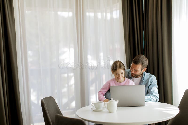 Father and Daughter Using Laptop Computer Together Stock Image - Image ...