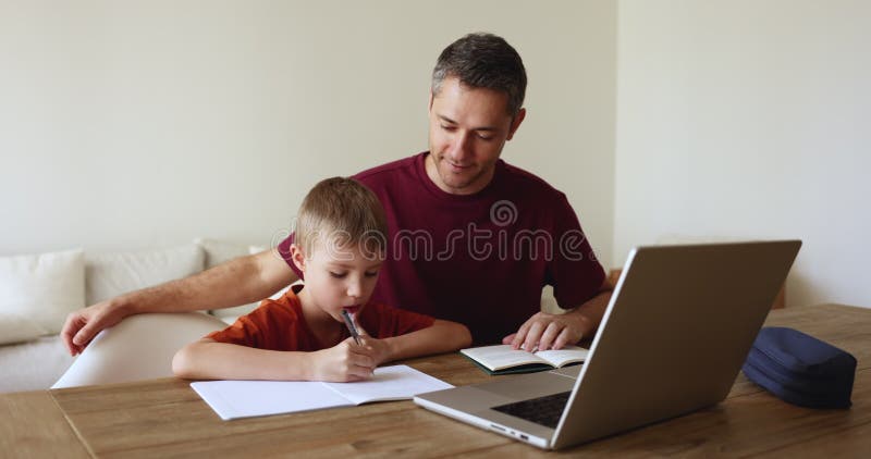 Father Doing Homework with Son, Help with Exercise, Explain Task Stock ...