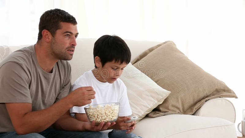 Father Eating Popcorn with His Son Stock Footage - Video of family ...