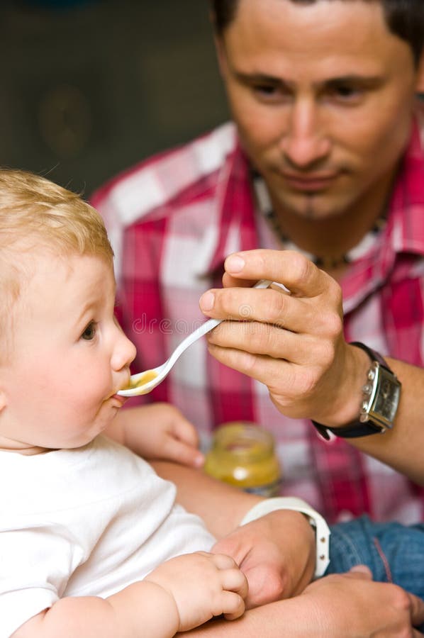 Father feeding baby stock image. Image of adult, parenthood - 15953839