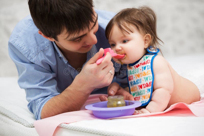 Father Feeding Baby Girl at Home Stock Image - Image of food, girl ...