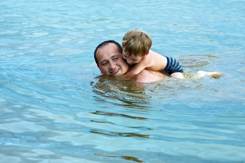 Father and Kid swimming stock image. Image of smiling - 10375481