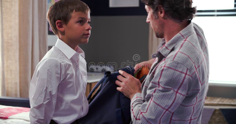 Father Getting Son Dressed Ready for School Stock Footage - Video of ...