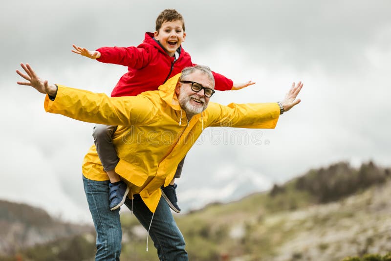 Father Giving Son Piggyback Ride Stock Photo - Image of giving, autumn ...