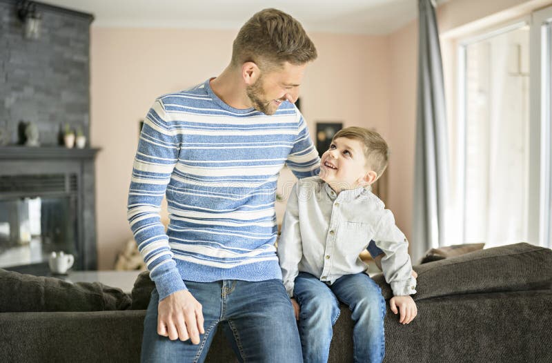 Father or Godfather Having Fun on the Living Room at Home Stock Image ...