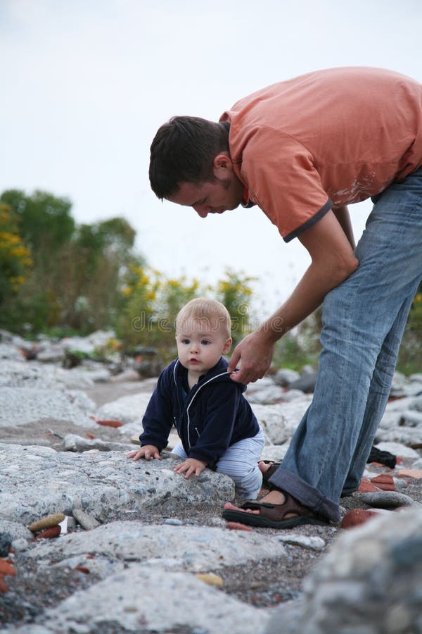 Father helping baby stock photo. Image of outdoors, happy - 29034806