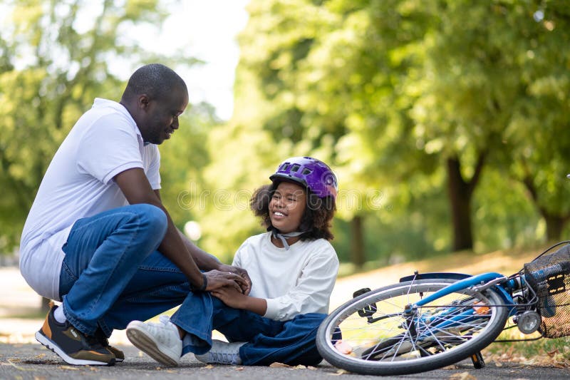 Father Helping His Kid after Falling from the Bike Stock Image - Image ...