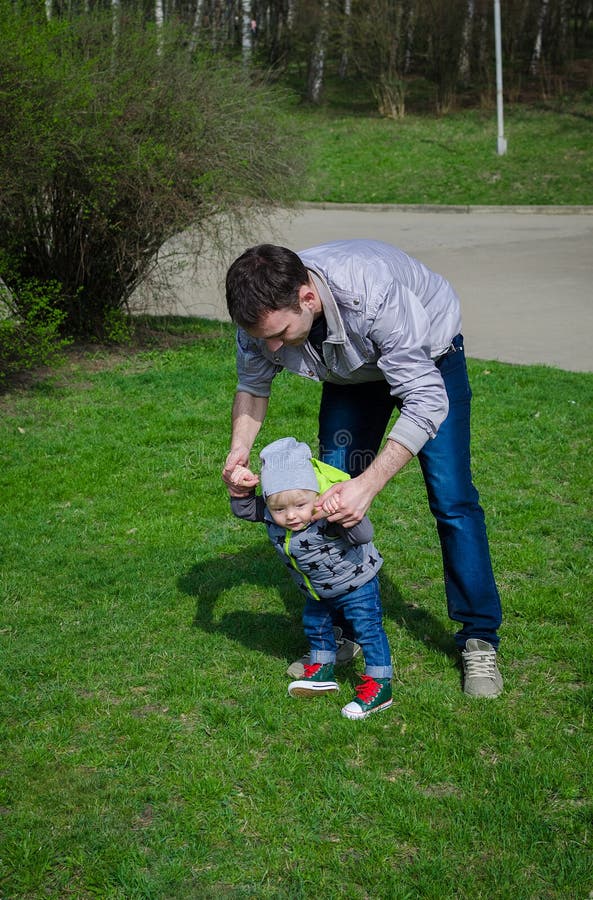 Father Helping His Son for the First Steps Stock Image - Image of male ...