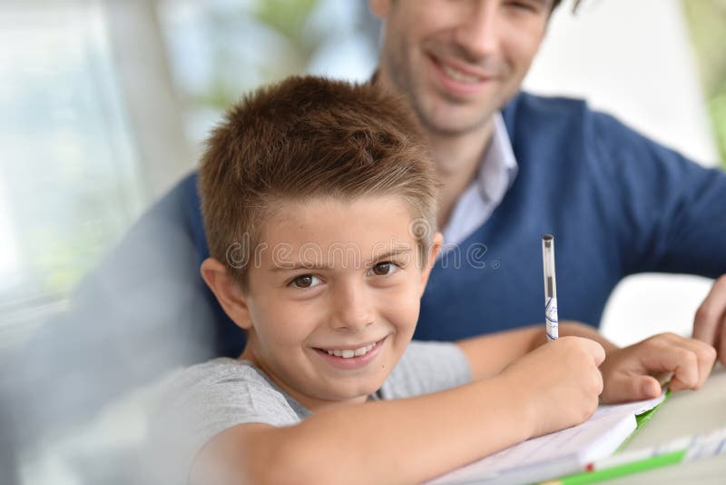 Father Helping His Son with Homework Stock Photo - Image of young, book ...