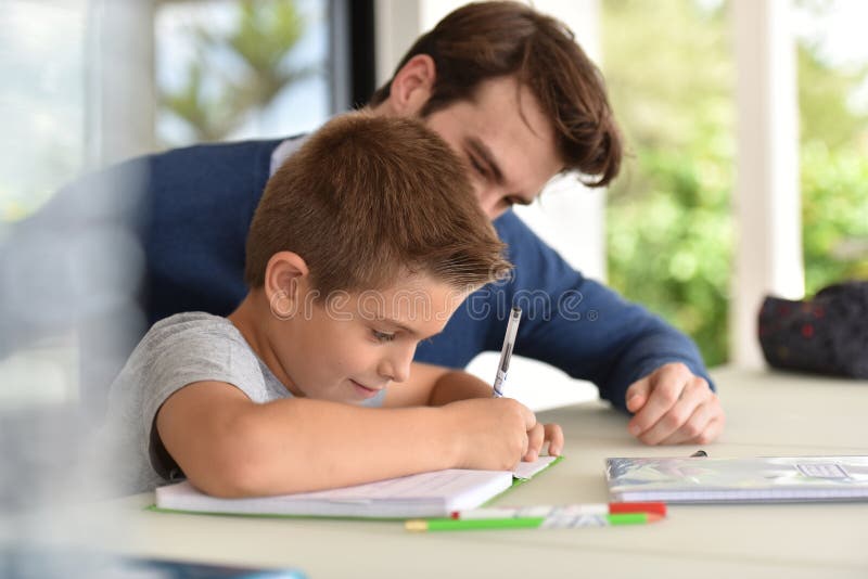 Father Helping His Son with Homework Stock Image - Image of daddy ...