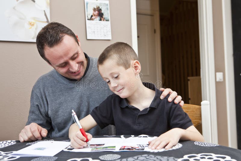Father Helping Son with Homework Stock Photo - Image of community ...