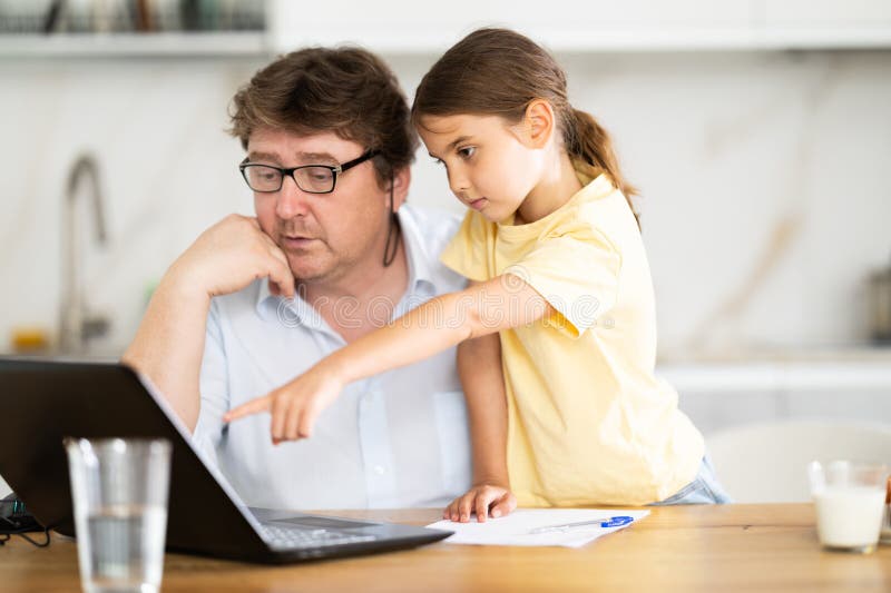Father Helps Daughter Do Homework Using Laptop Stock Image - Image of ...