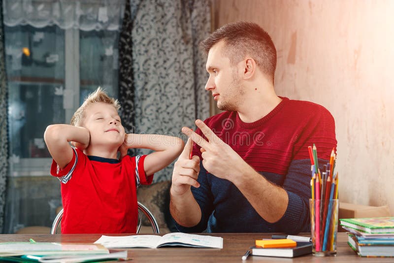 The Father Helps His Son To Do Homework for the School. Stock Image ...