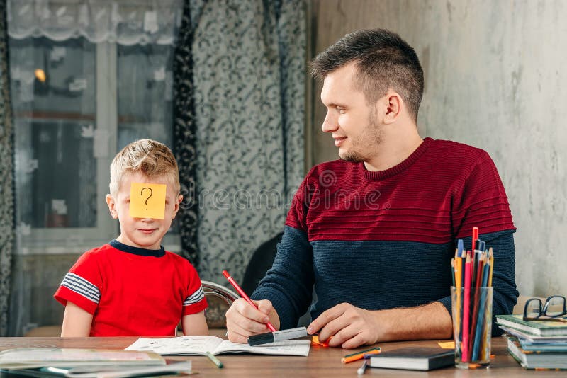 The Father Helps His Son To Do Homework for the School. Stock Image ...
