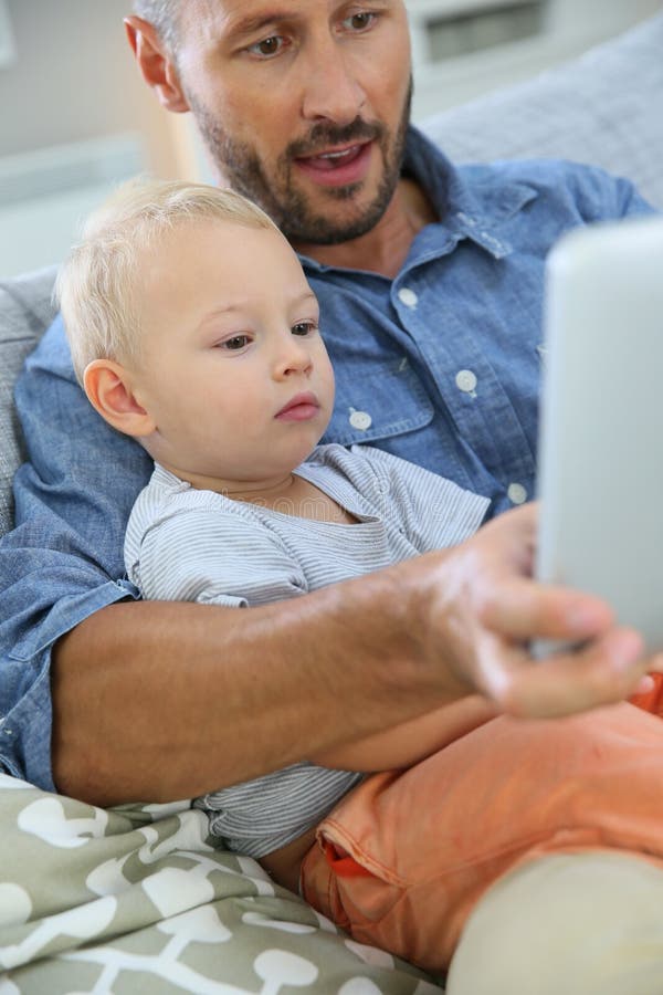 Father and His Baby Boy Using Tablet Stock Image - Image of technology ...