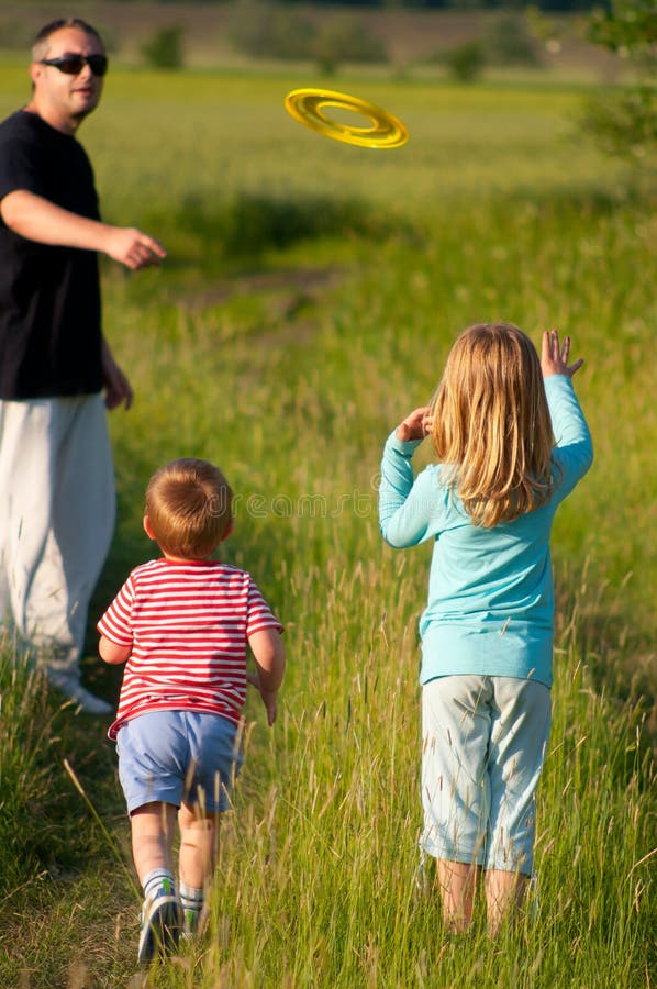 Father and His Children Play with Frisbee Stock Image - Image of ...