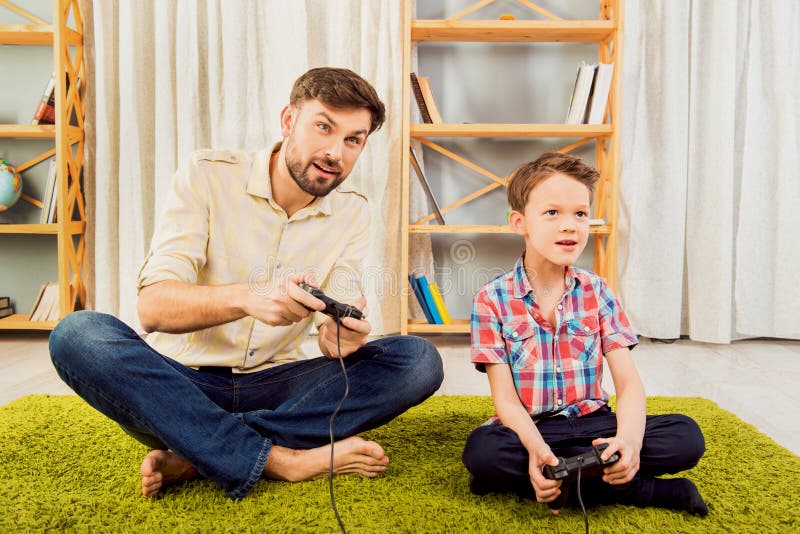 Father and His Little Son Playing Video Games Stock Image - Image of ...