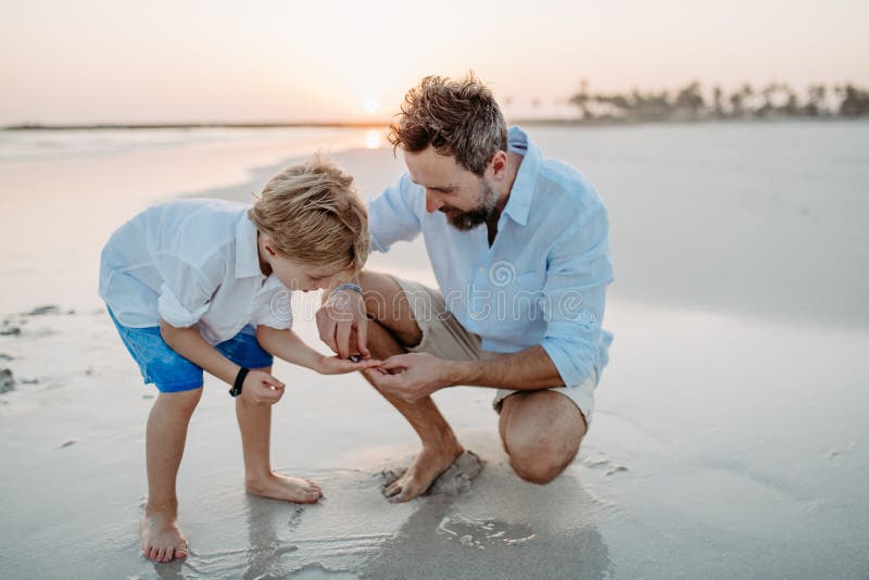 Father with His Son Enjoying Together Time at Sea. Stock Photo - Image ...