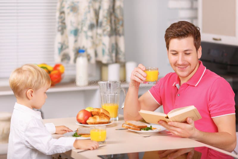 Father and His Son are Having Fine Breakfast Stock Photo - Image of ...