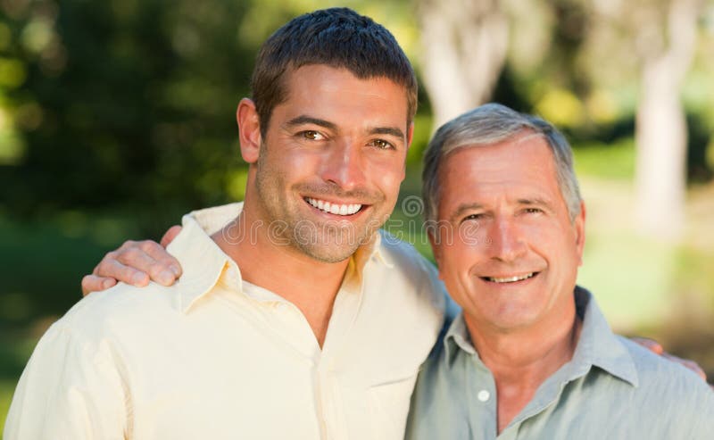 Father with His Son Looking at the Camera Stock Image - Image of child ...