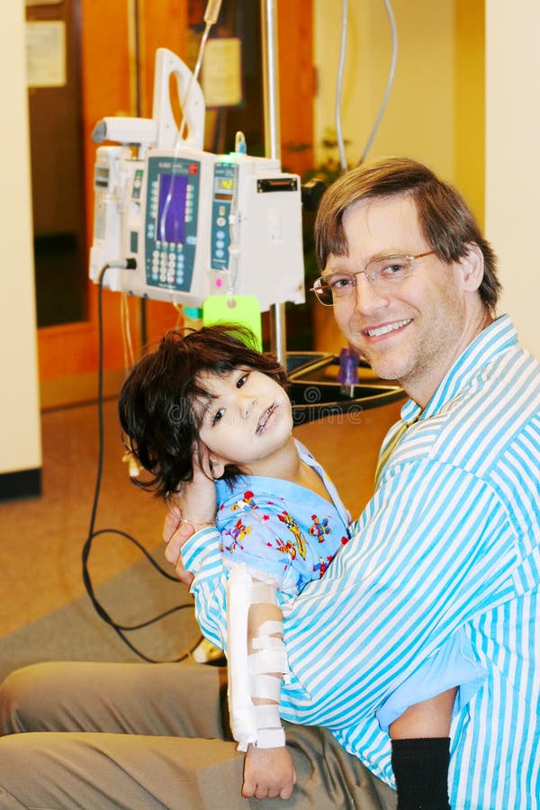 Father Holding Toddler Boy in ER Stock Photo - Image of health, room ...