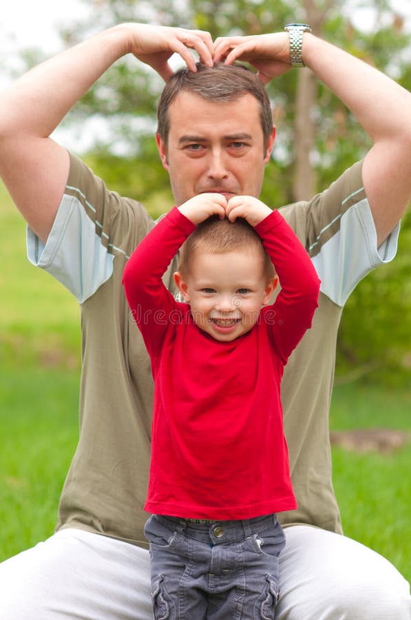Father imitates his son stock photo. Image of handsome - 24720236