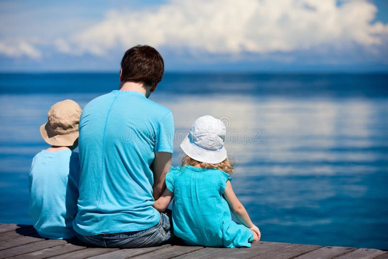 Father and Kids Sitting on Wooden Dock Stock Photo - Image of family ...