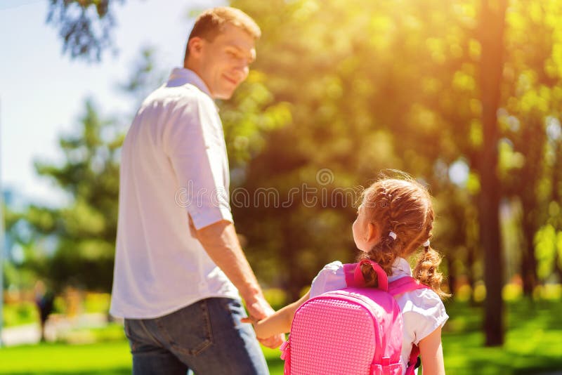 Father Leads Daughter To School in First Grade. First Day at School ...
