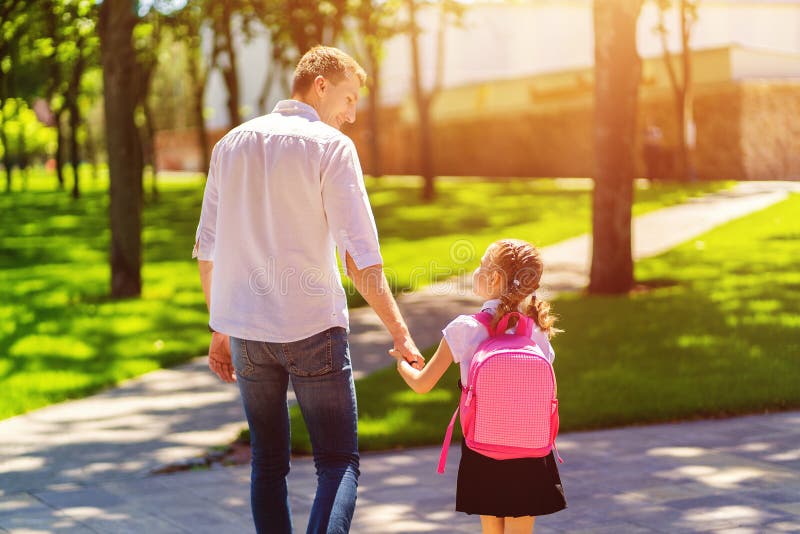 Father Leads Daughter To School in First Grade. First Day at School ...