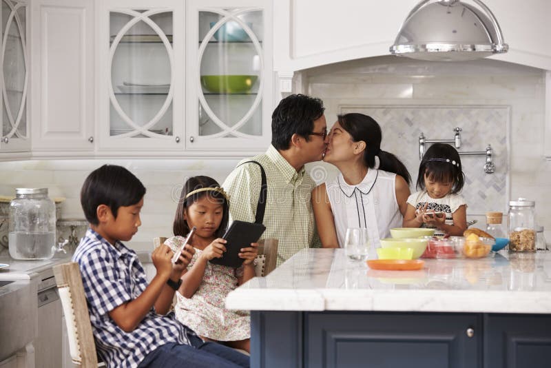 Father Leaving for Work after Family Breakfast in Kitchen Stock Photo ...