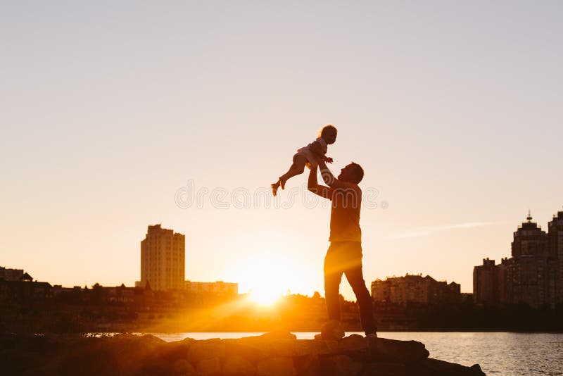Father with Little Child at Sunset Stock Photo - Image of leisure, care ...