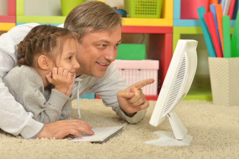 Dad and Daughter with Computer Stock Image - Image of small, person ...