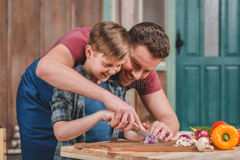 Father with Little Son Preparing Food on Table at Backyard Stock Image ...