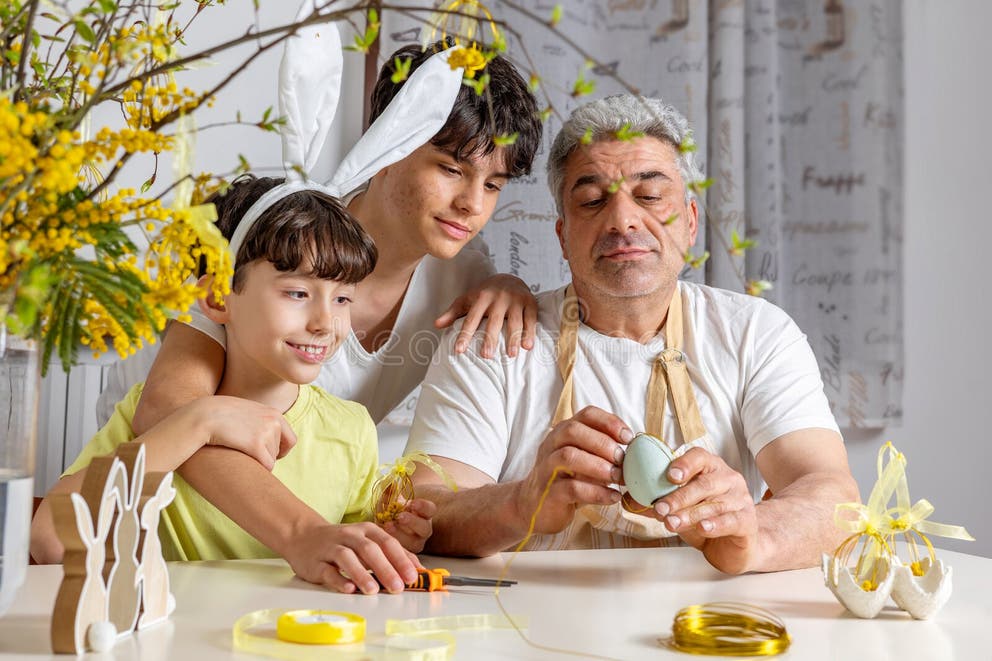 Father Making Handmade Easter Egg Wire Decor with His Sons at a Festive ...