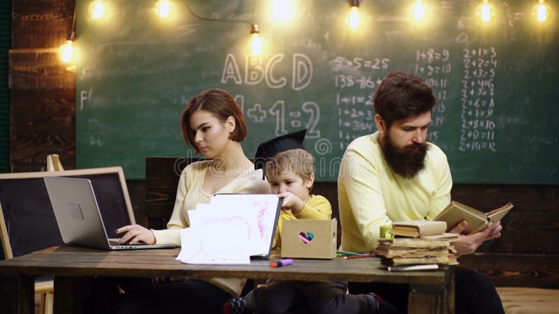 Father and Mother Teach Lovely Son To Draw and Paint. Kids Learning and ... Father and Mother Teach Lovely Son To Draw and Paint. Kids Learning and ...