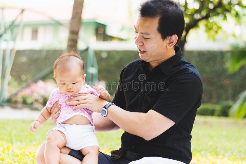 Father Parenting Baby on Park Stock Photo - Image of summer, family ...
