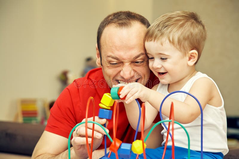 Father Playing with His Child in Developing Game at Home. Dad and Son ...