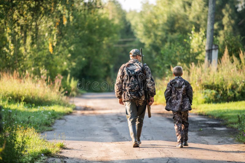 Father Pointing and Guiding Son on First Deer Hunt Stock Image - Image ...